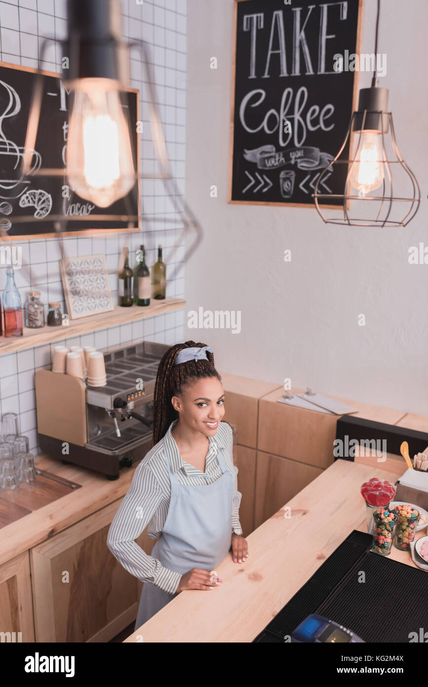 barista standing behind counter Stock Photo - Alamy