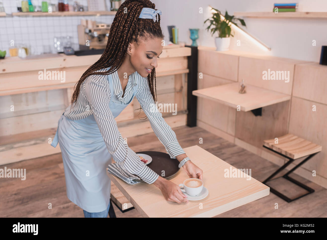 barista serving table Stock Photo - Alamy