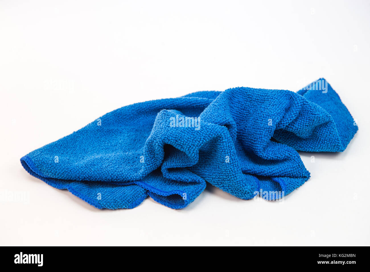 Crumpled blue microfiber cloth isolated on white background Stock Photo ...