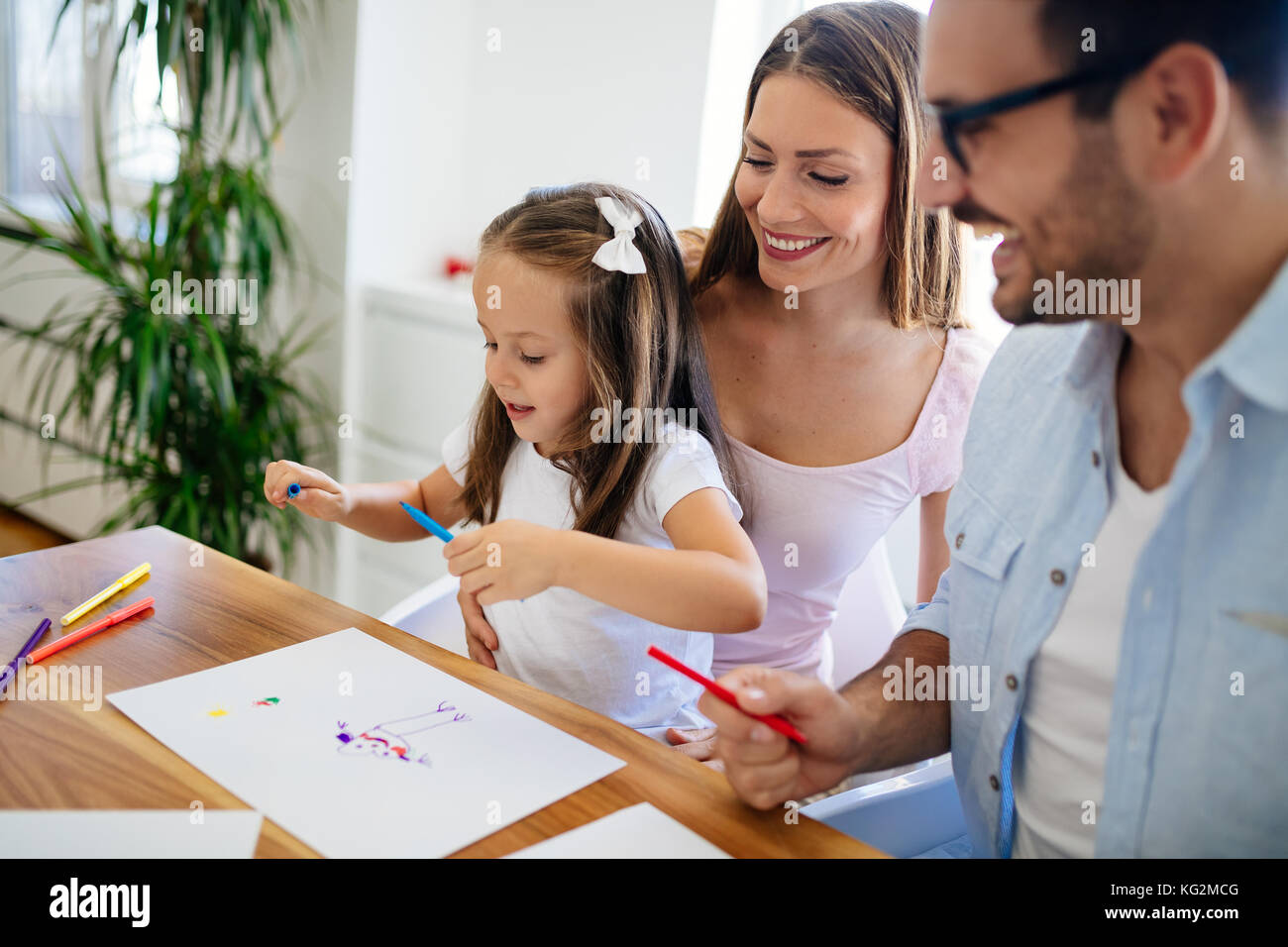 Happy familiy spending fun time at home Stock Photo - Alamy