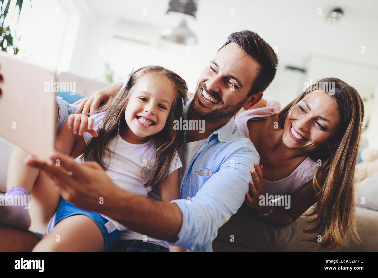 Happy family having fun times at home Stock Photo - Alamy