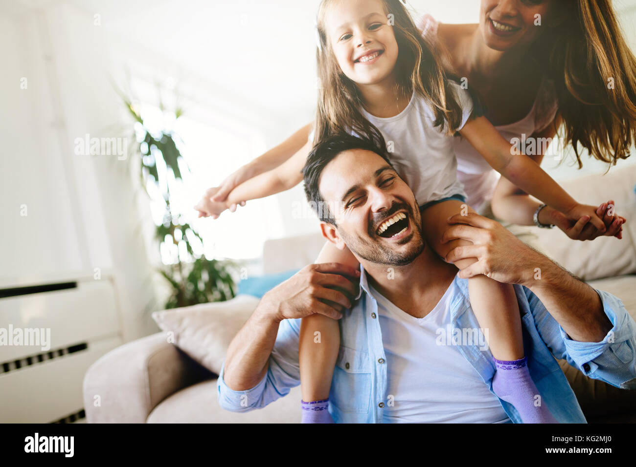 Happy family having fun times at home hi-res stock photography and ...