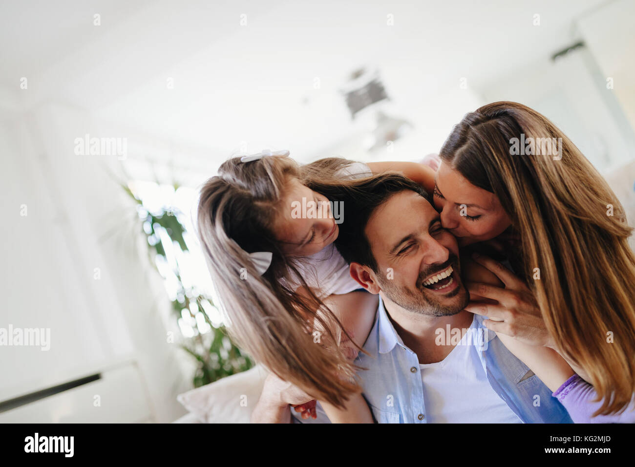 Happy family having fun times at home Stock Photo - Alamy