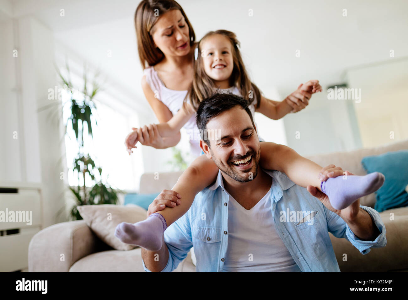 Happy family having fun times at home Stock Photo - Alamy