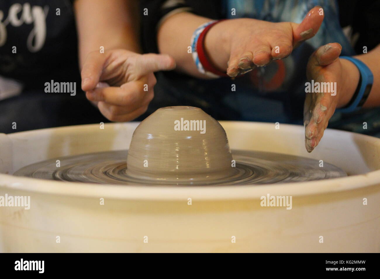 Visitors having a go at pottery at Cardiff's 2017 Made By Hand Pottery ...