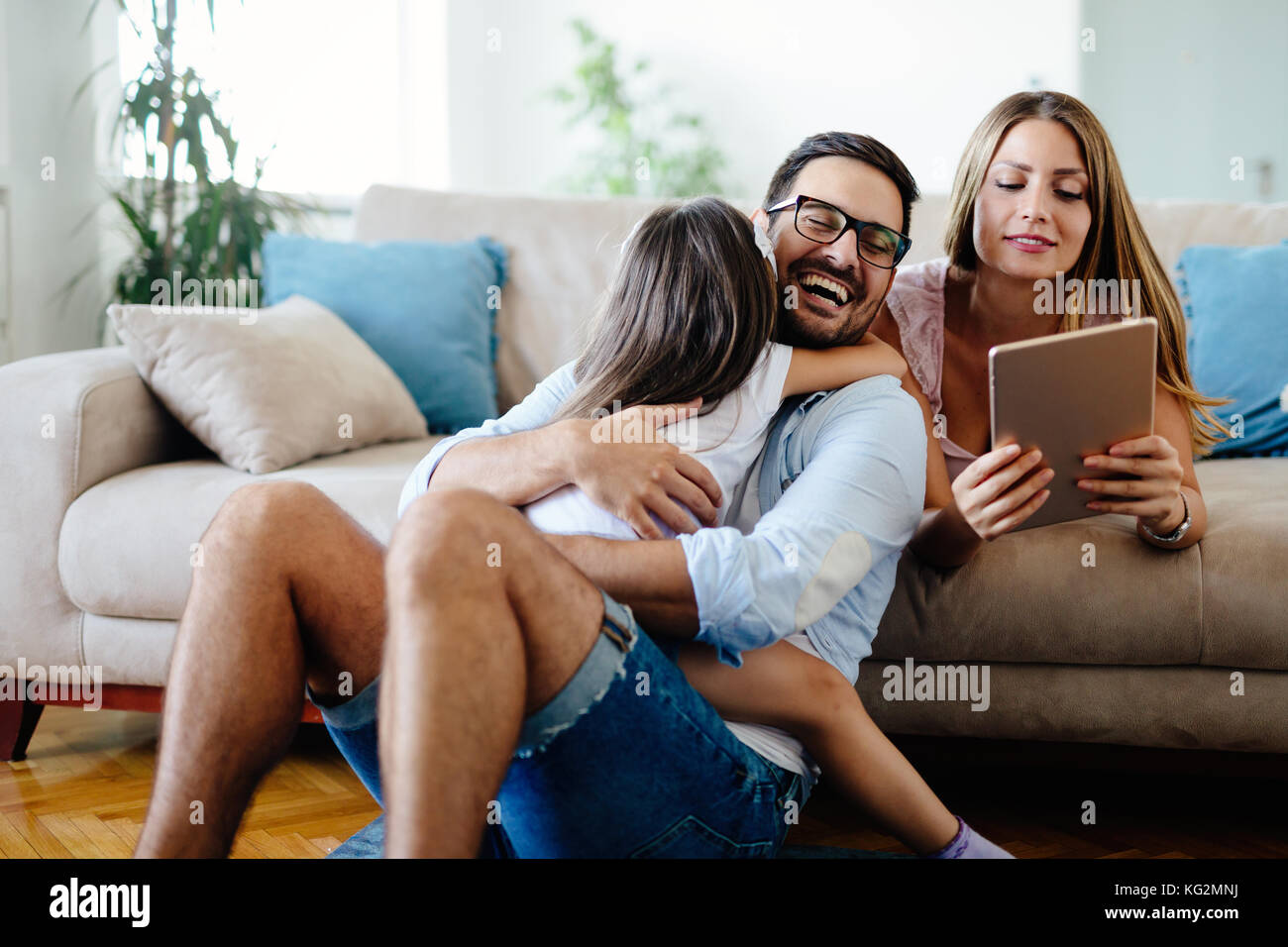Happy family spending time home hi-res stock photography and images - Alamy