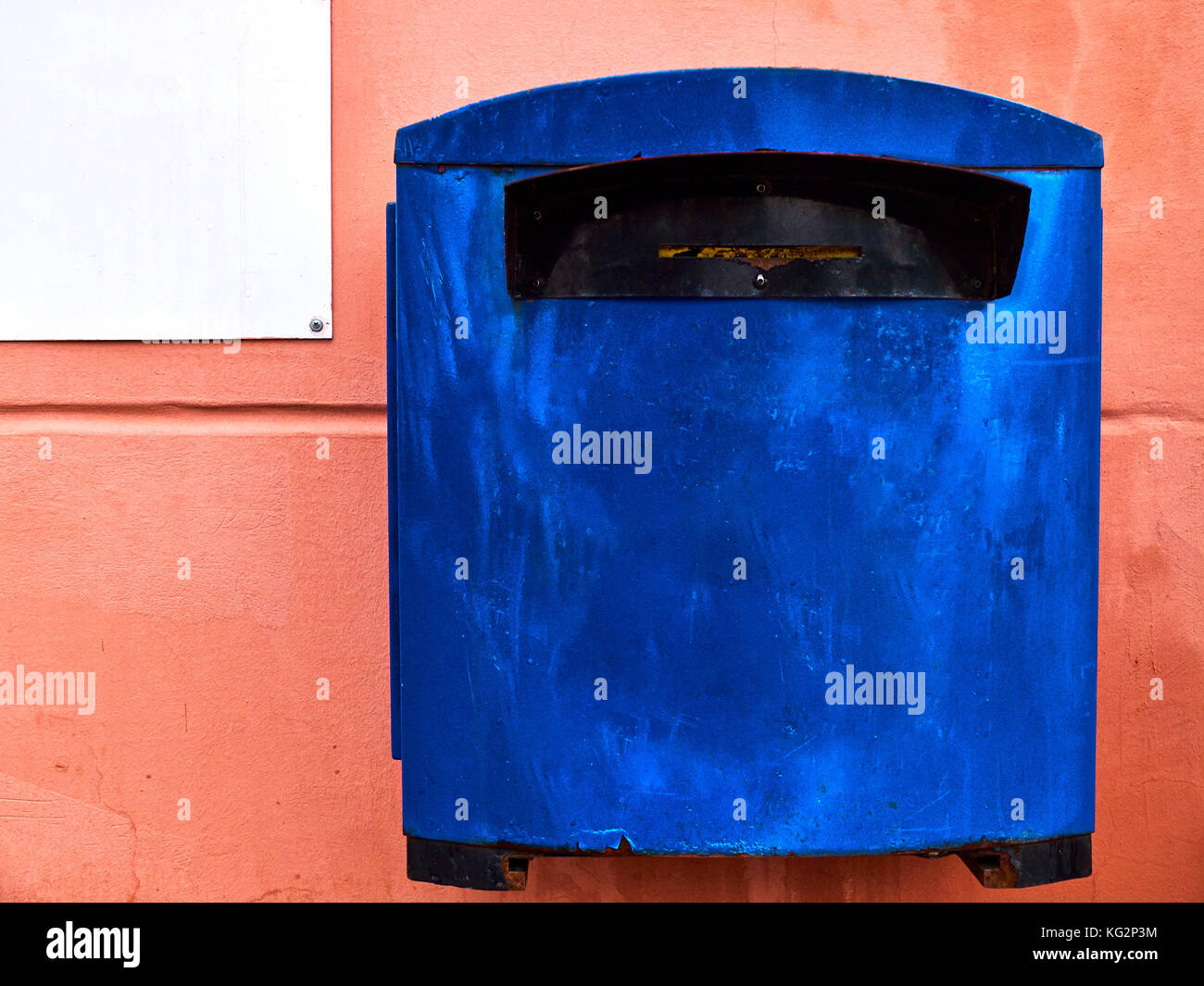 Rusty blue mailbox on the flat peachy wall Stock Photo - Alamy
