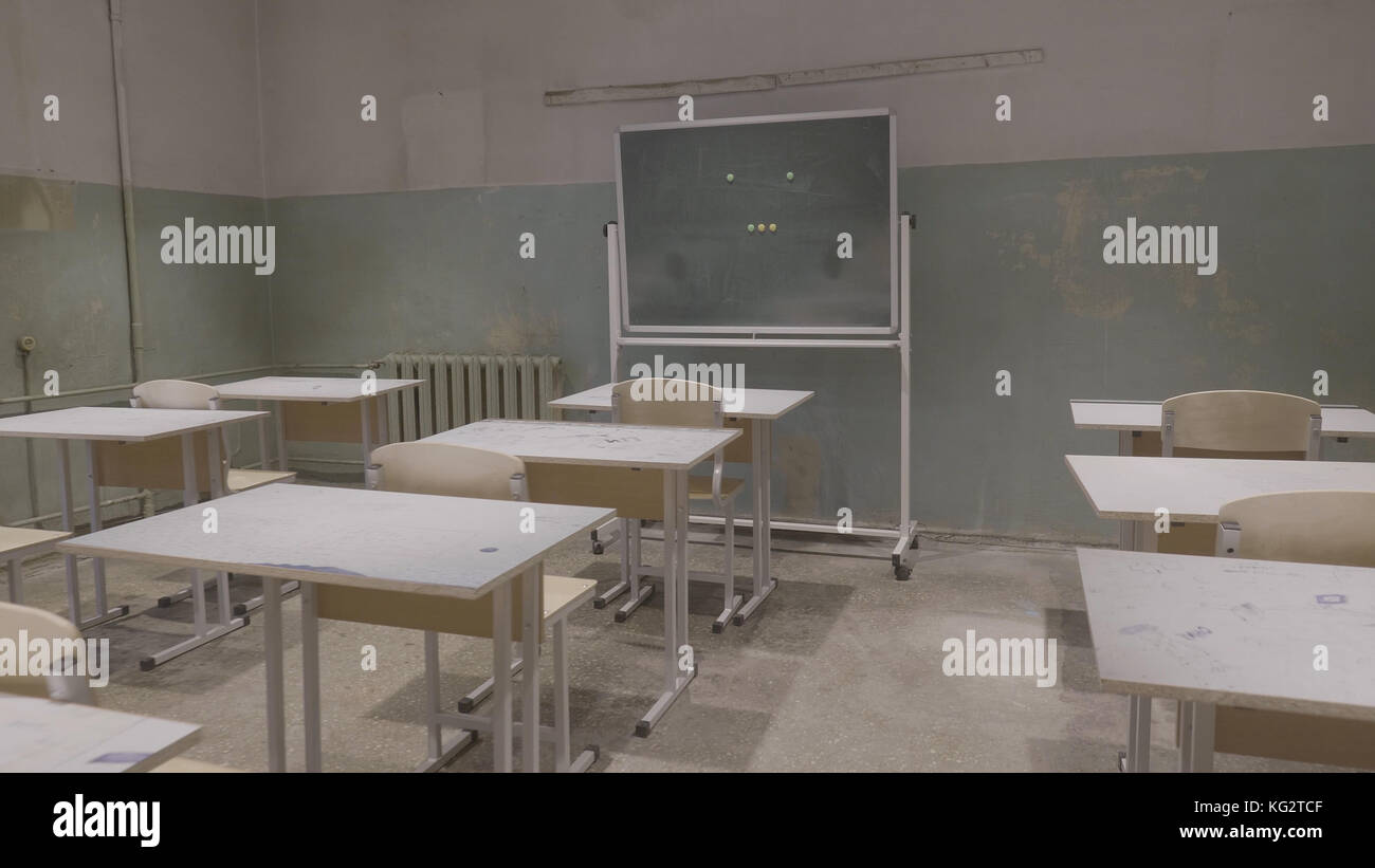 Empty classroom with wooden desks, white and green chalk boards in school. empty classroom ...