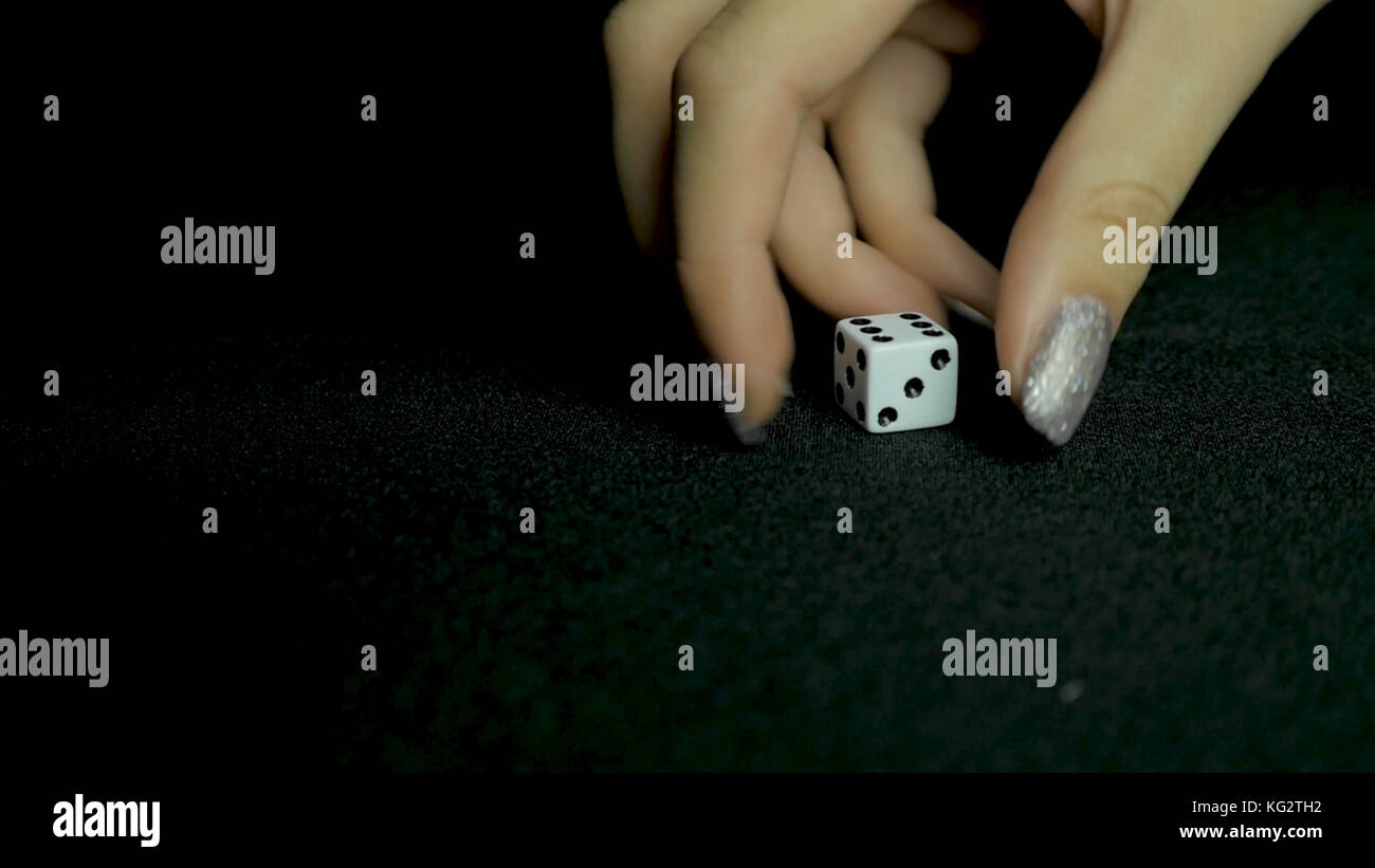 Woman Hand Rolling Dice
