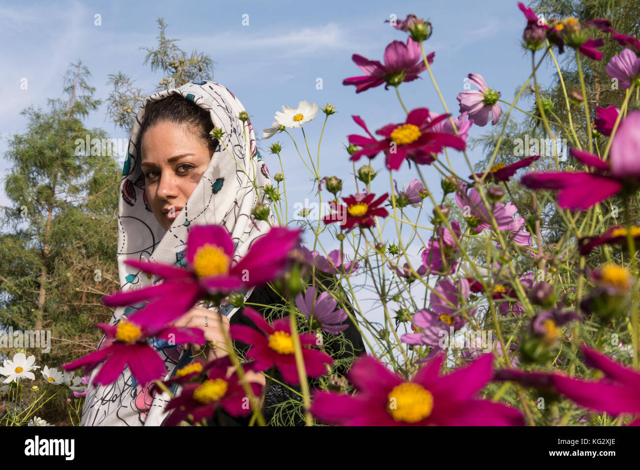 Woman park flowers behind hi-res stock photography and images - Alamy
