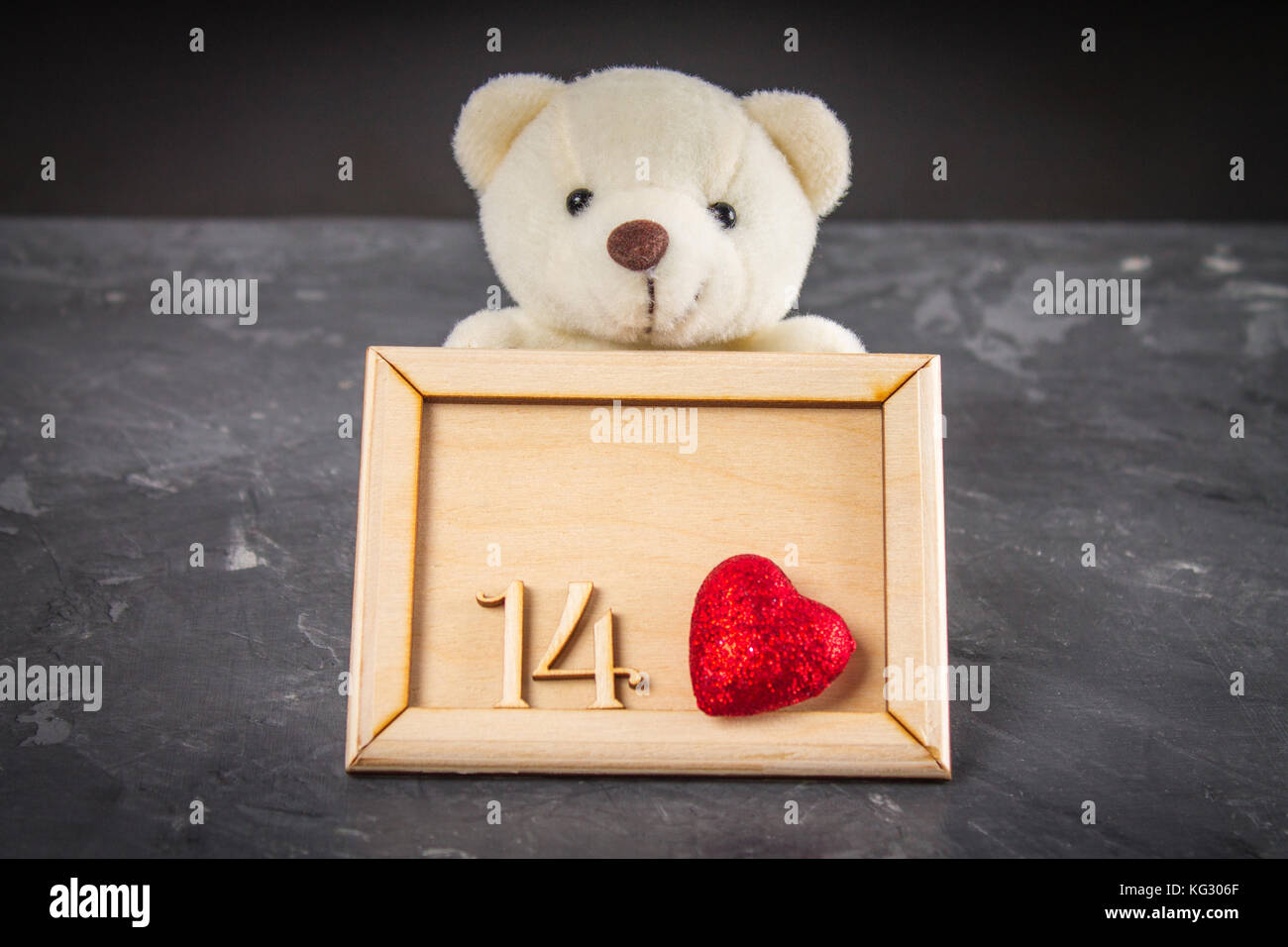White teddy bear holding a wooden frame with the numbers 14 and heart ...
