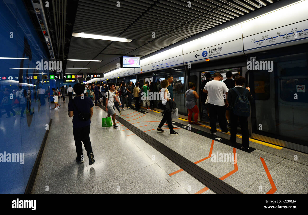 Commuters waiting on the Island line MTR platform in Admiralty station ...