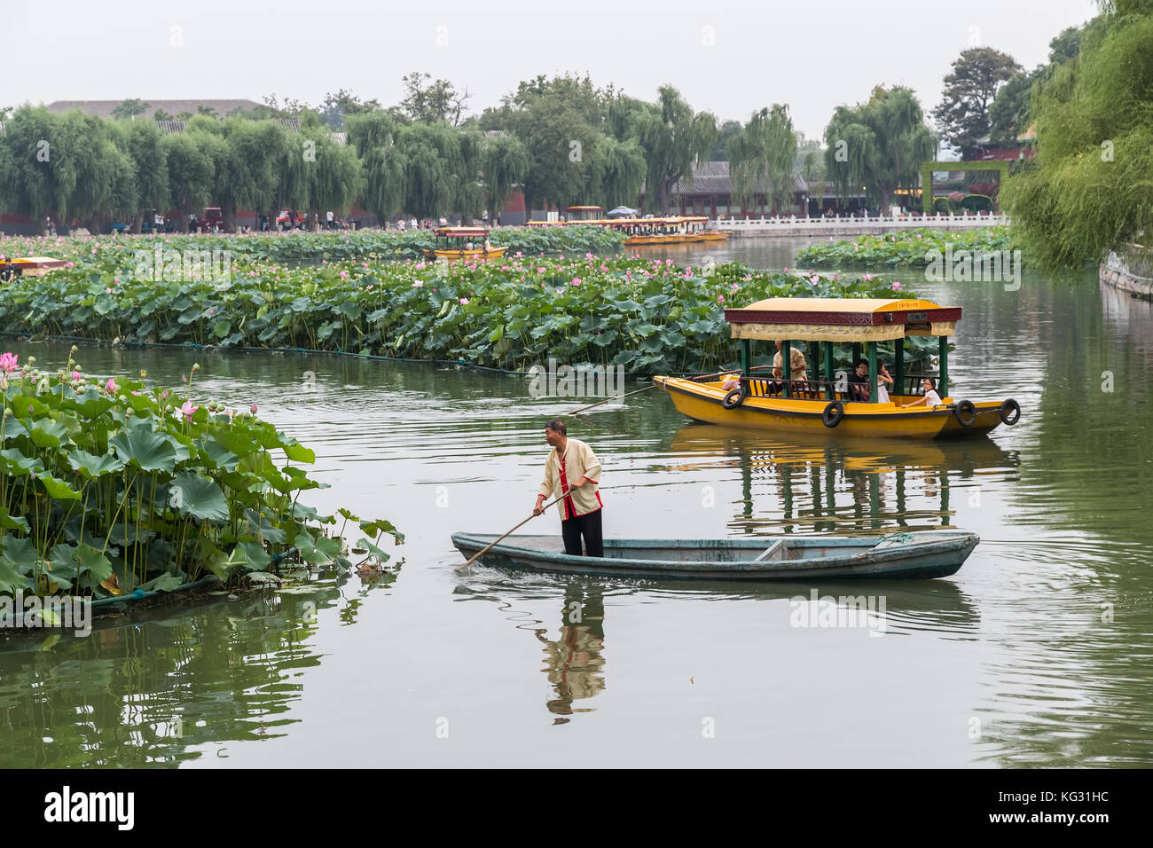 People sailing boats in the moat around Forbidden Palace, Beijing ...