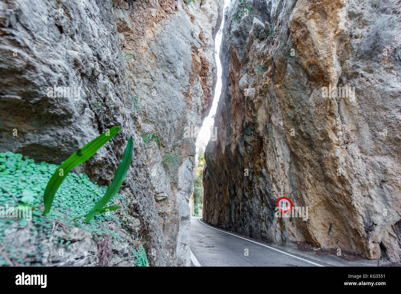 Asphalt road between high rocks Stock Photo - Alamy