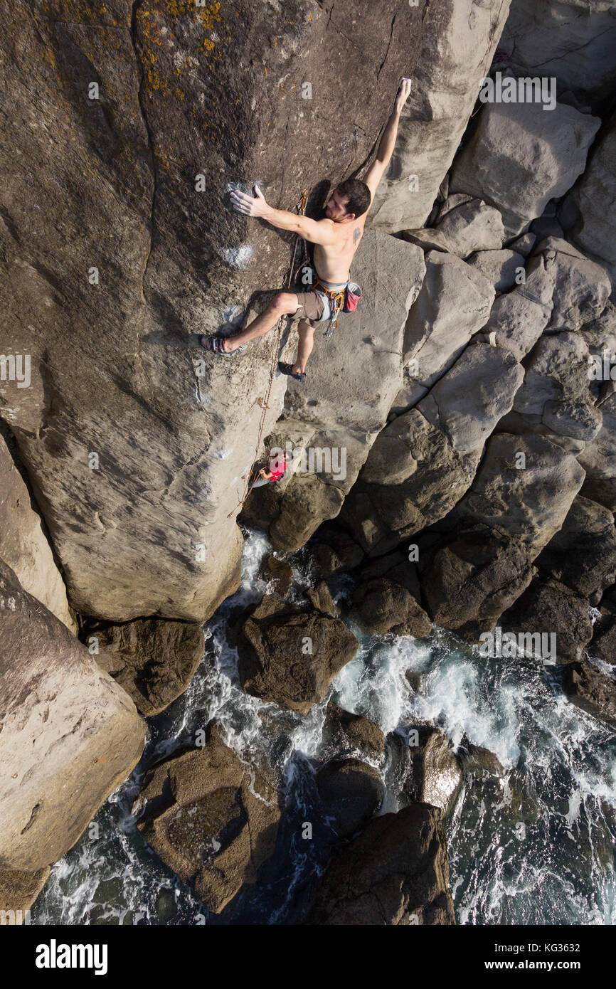 James Field-Mitchell climbing at Ti Point near Leigh, New Zealand Stock ...