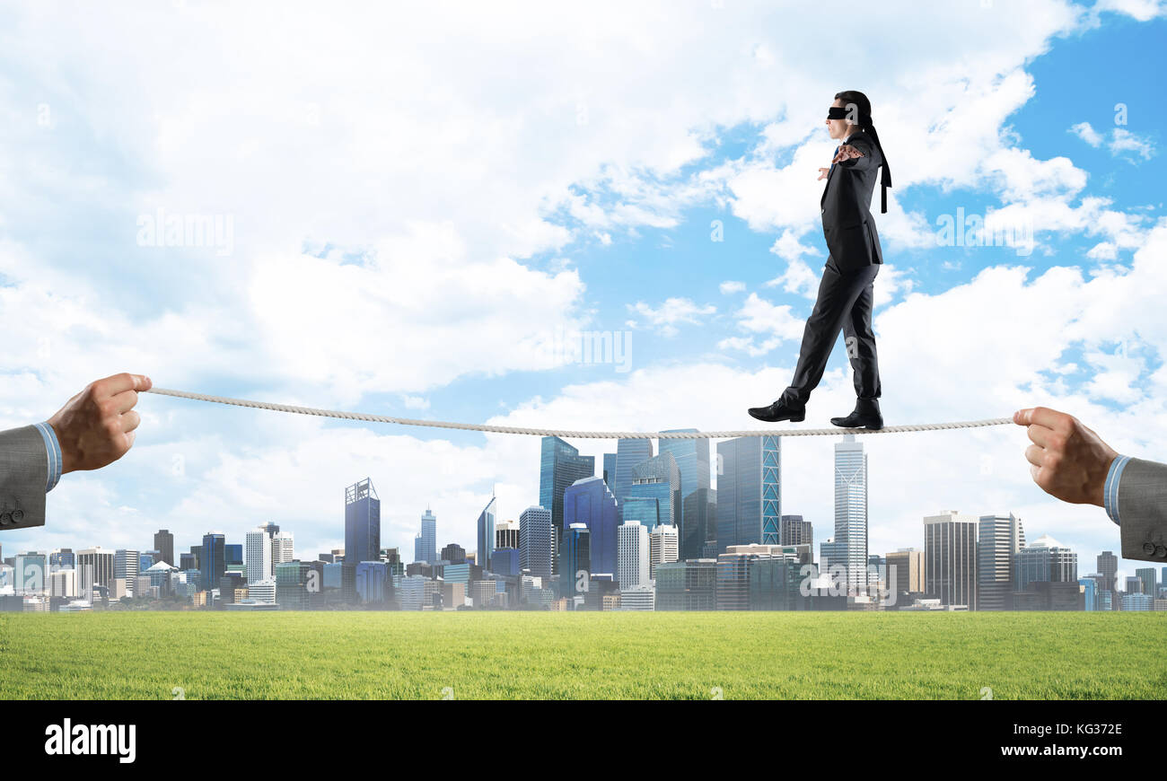 Man balancing on rope hi-res stock photography and images - Alamy