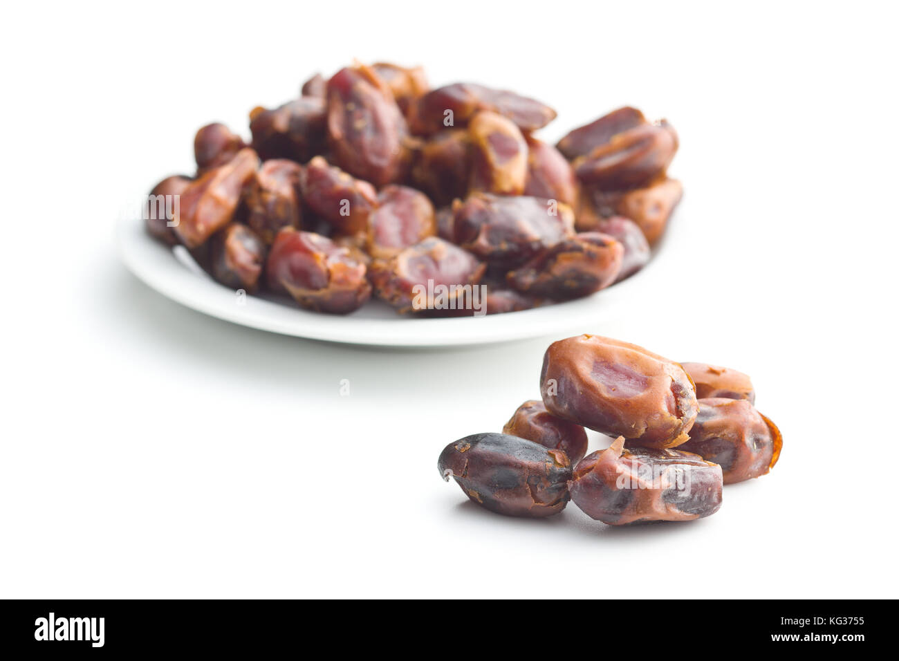 Sweet dates without stones islated on white background Stock Photo - Alamy