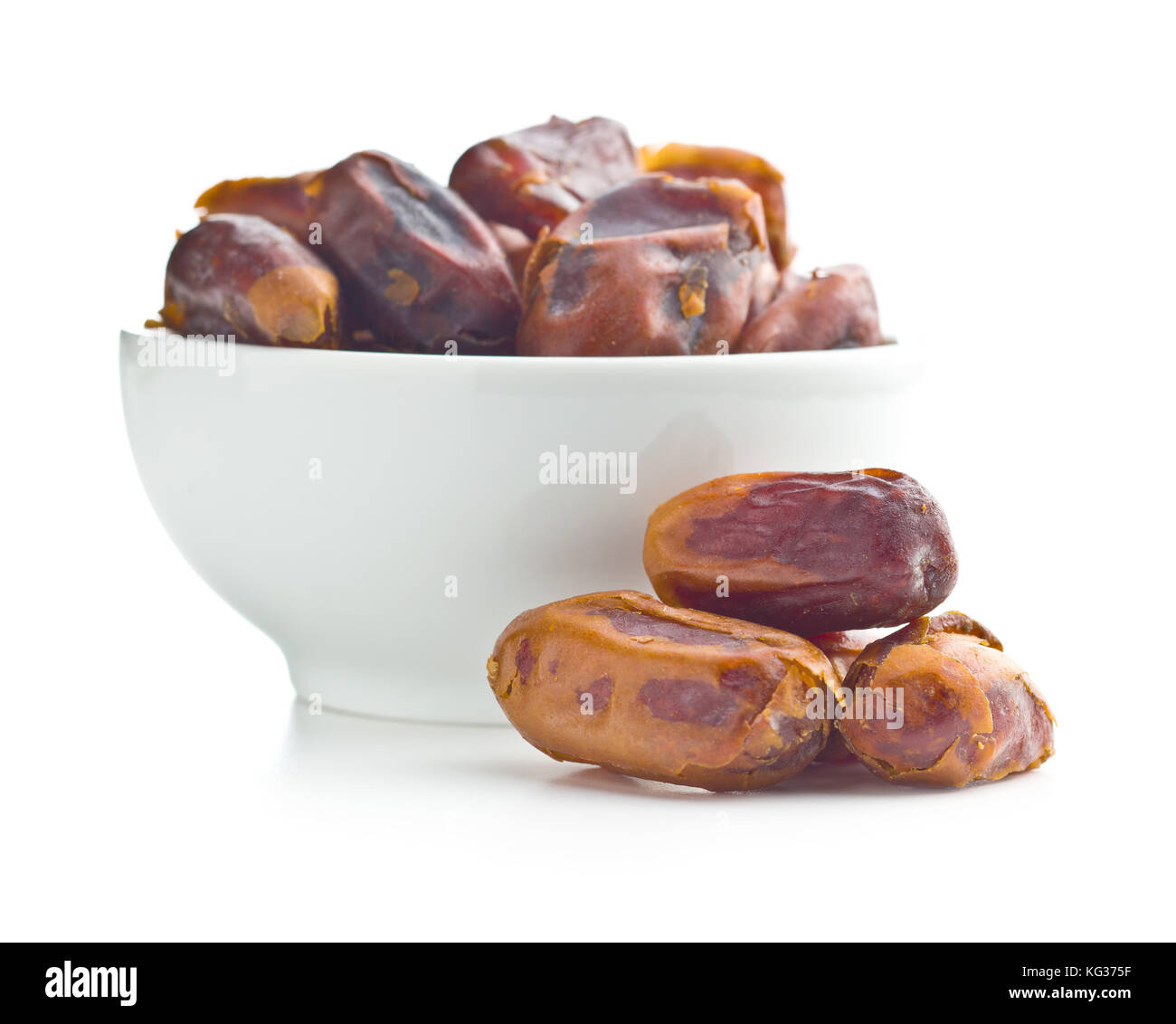 Sweet dates without stones in bowl isolated on white background Stock ...