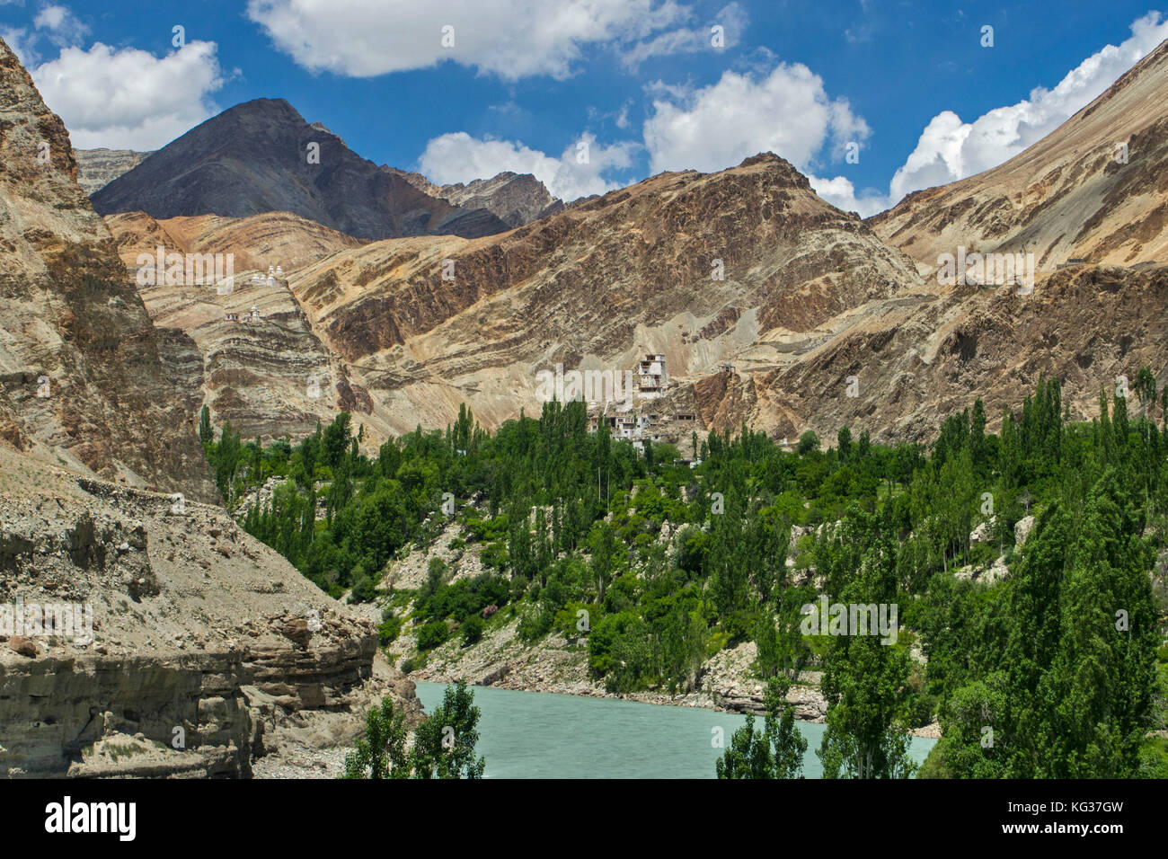 Mountain gorge of the Indus River, calm water aquamarine color, trees ...