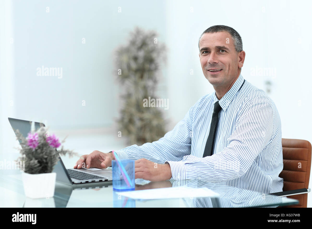 closeup .businessman sitting behind a Desk.photo with copy space Stock ...