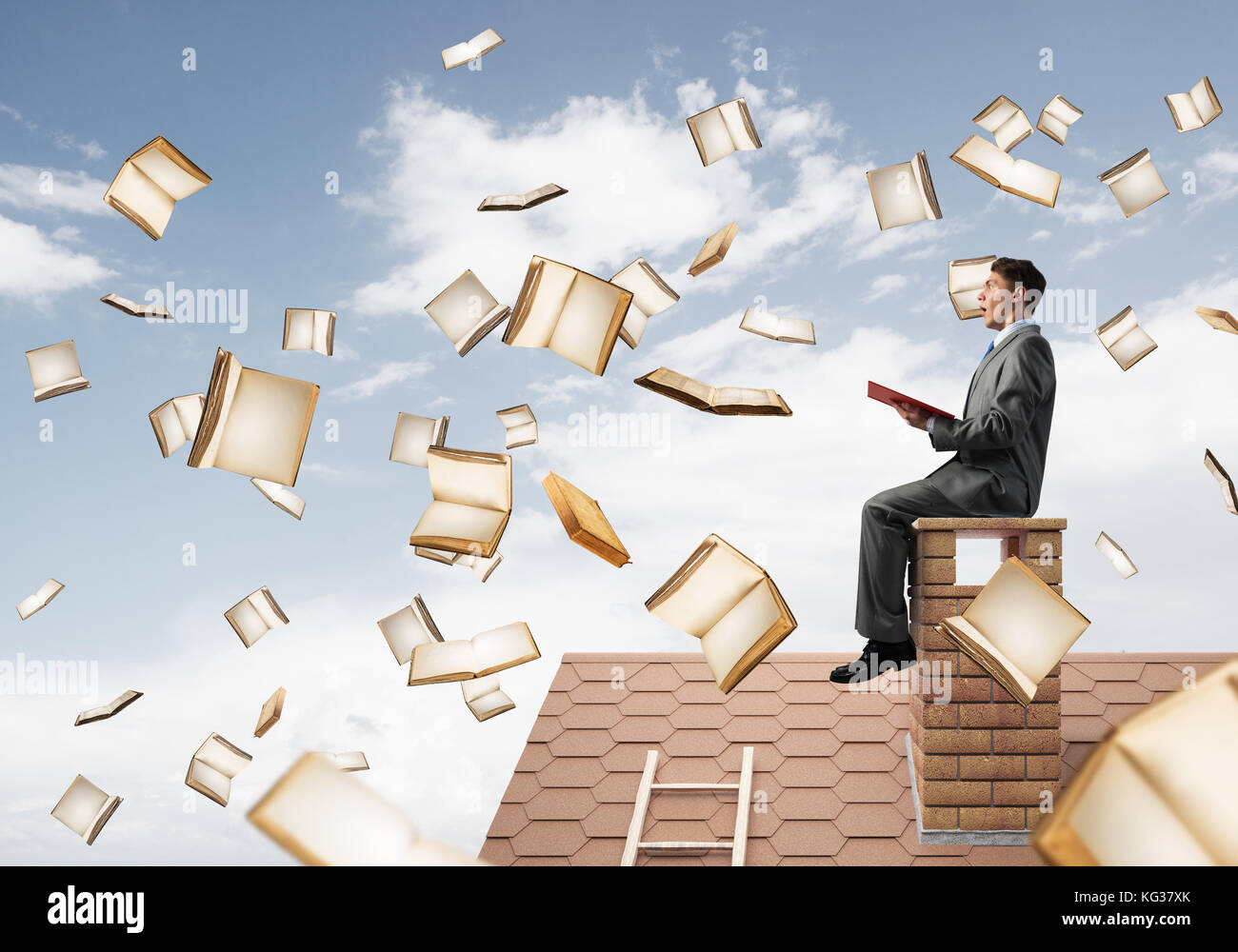 Man reading book and many of them flying in air Stock Photo - Alamy