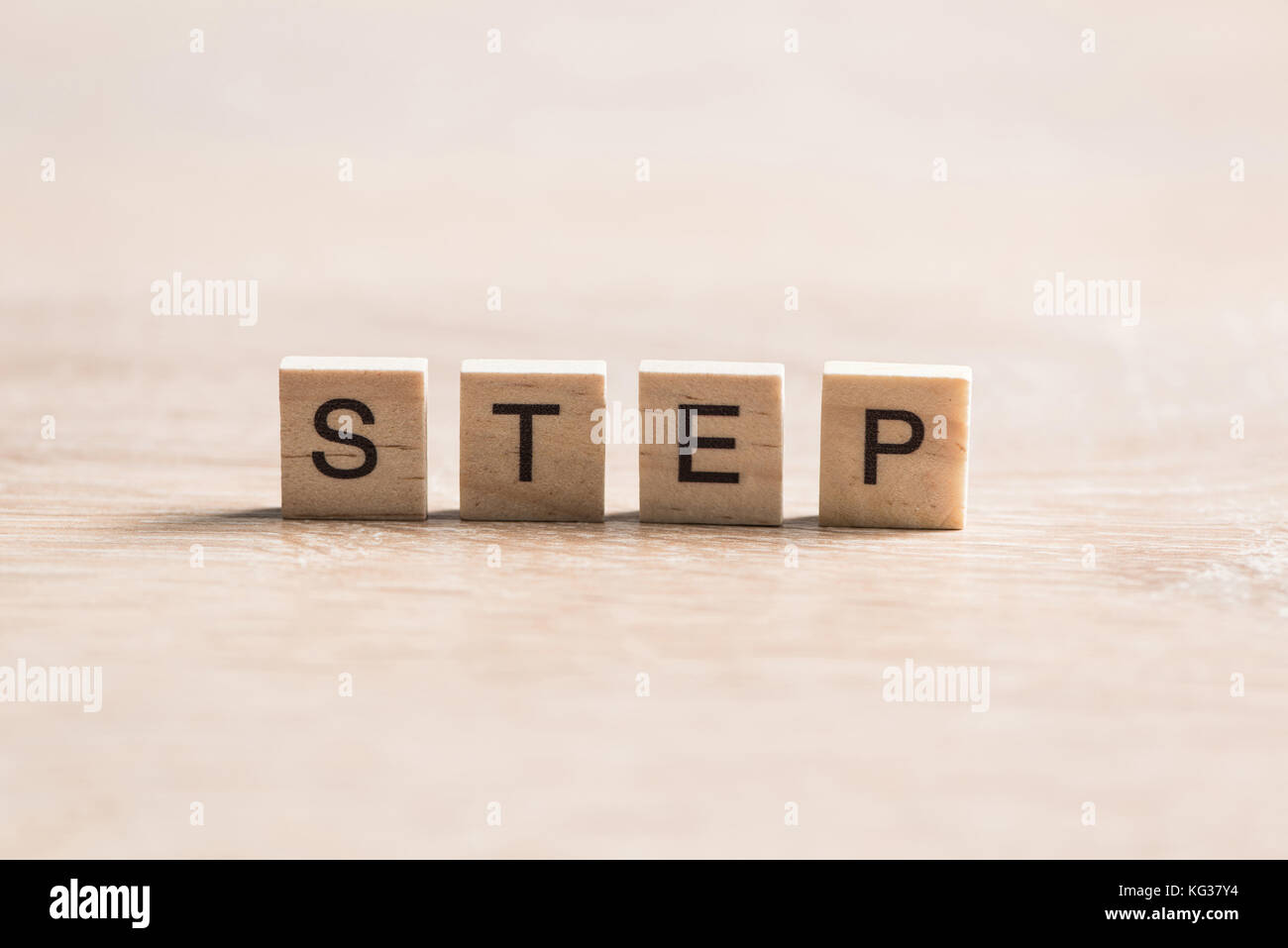 wooden elements with letter collected word step Stock Photo - Alamy