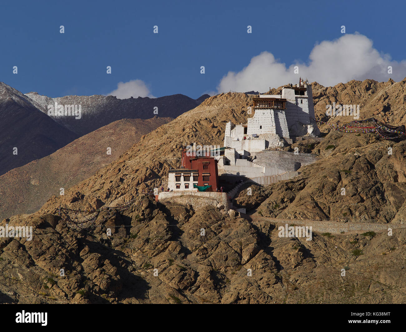 Buddhist monastery Namgyal Tseto, white and burgundy buildings on top ...