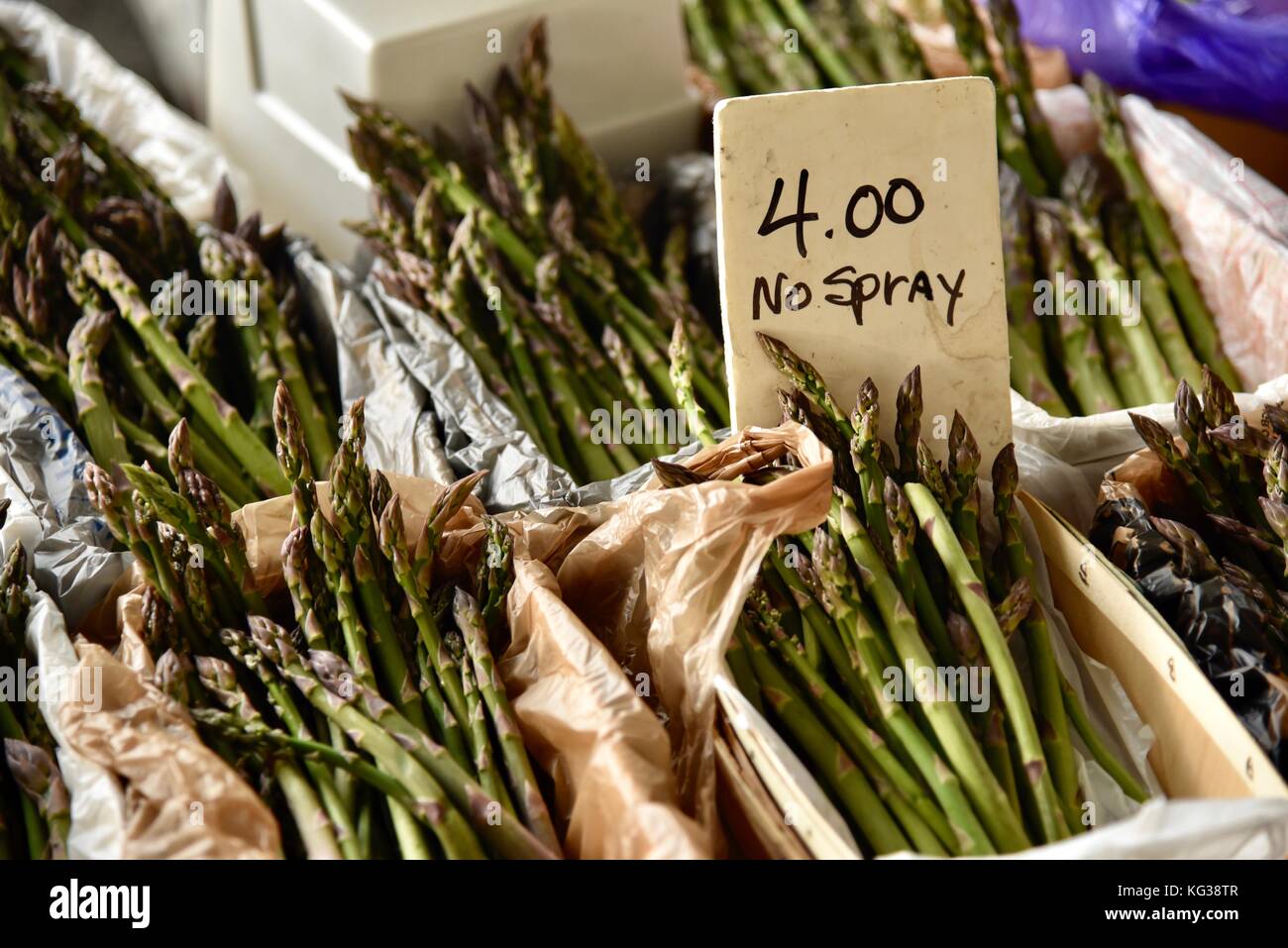 Farm fresh asparagus on display with "no spray" sign at Ann Arbor ...
