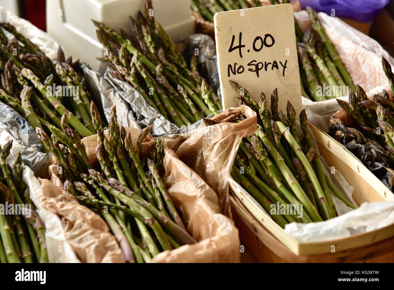 Farm fresh asparagus on display with "no spray" sign at Ann Arbor ...