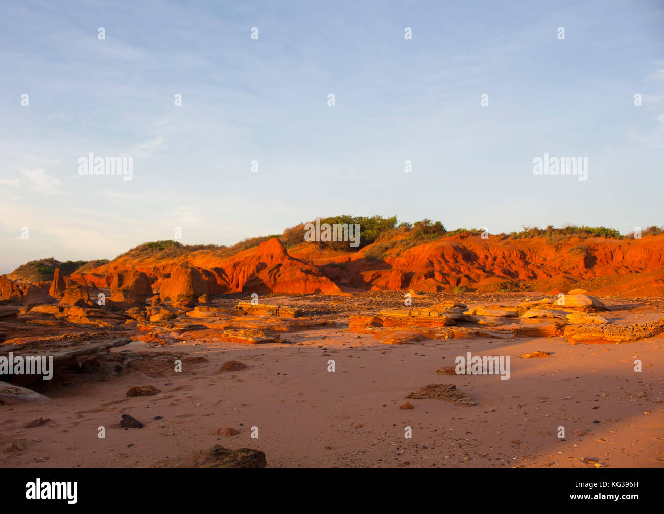 Setting sun highlight the rocks at Gantheaume Point, a red-sandstone ...