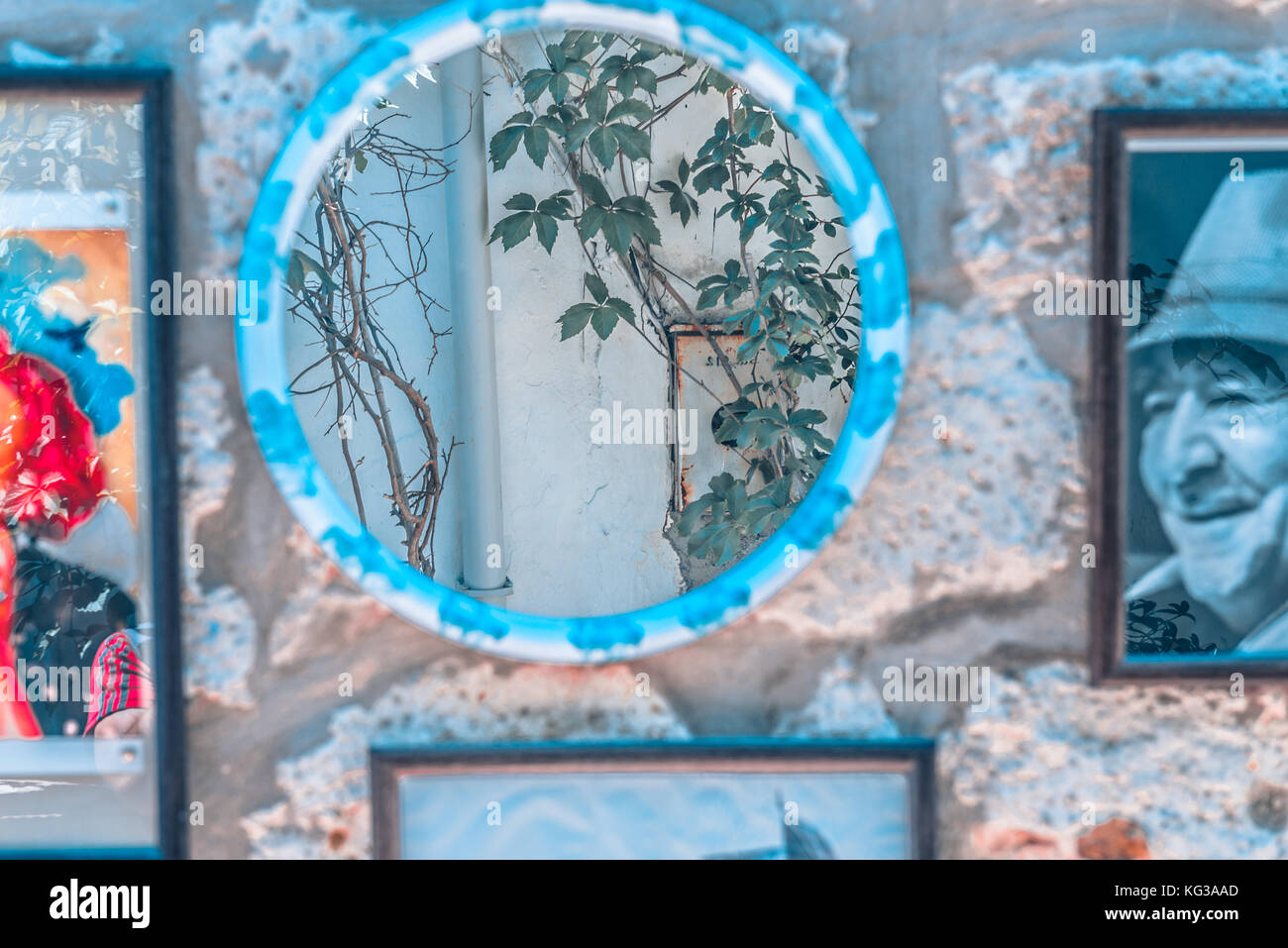 Frames with photos of famous Turkish people and places on white wall ...