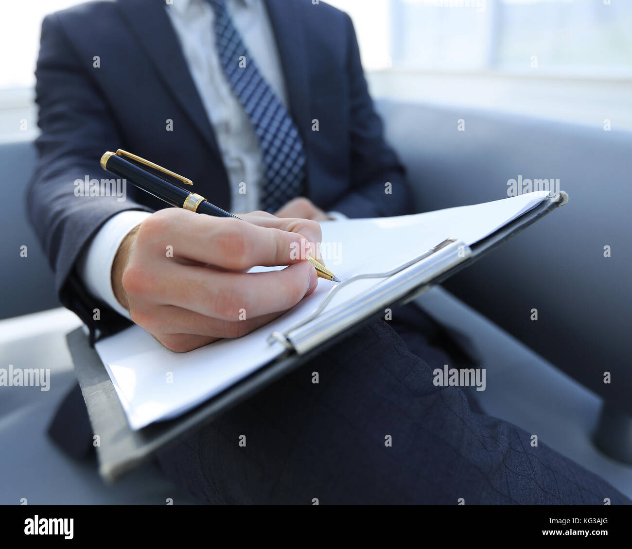 Closeup of human hand writing on a paper Stock Photo - Alamy