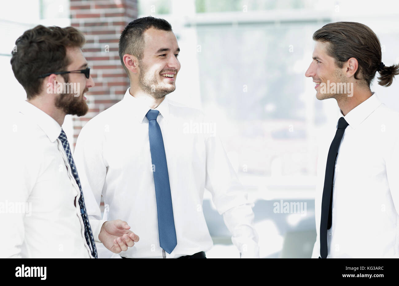employees are talking ,standing in the office.photo with copy space ...