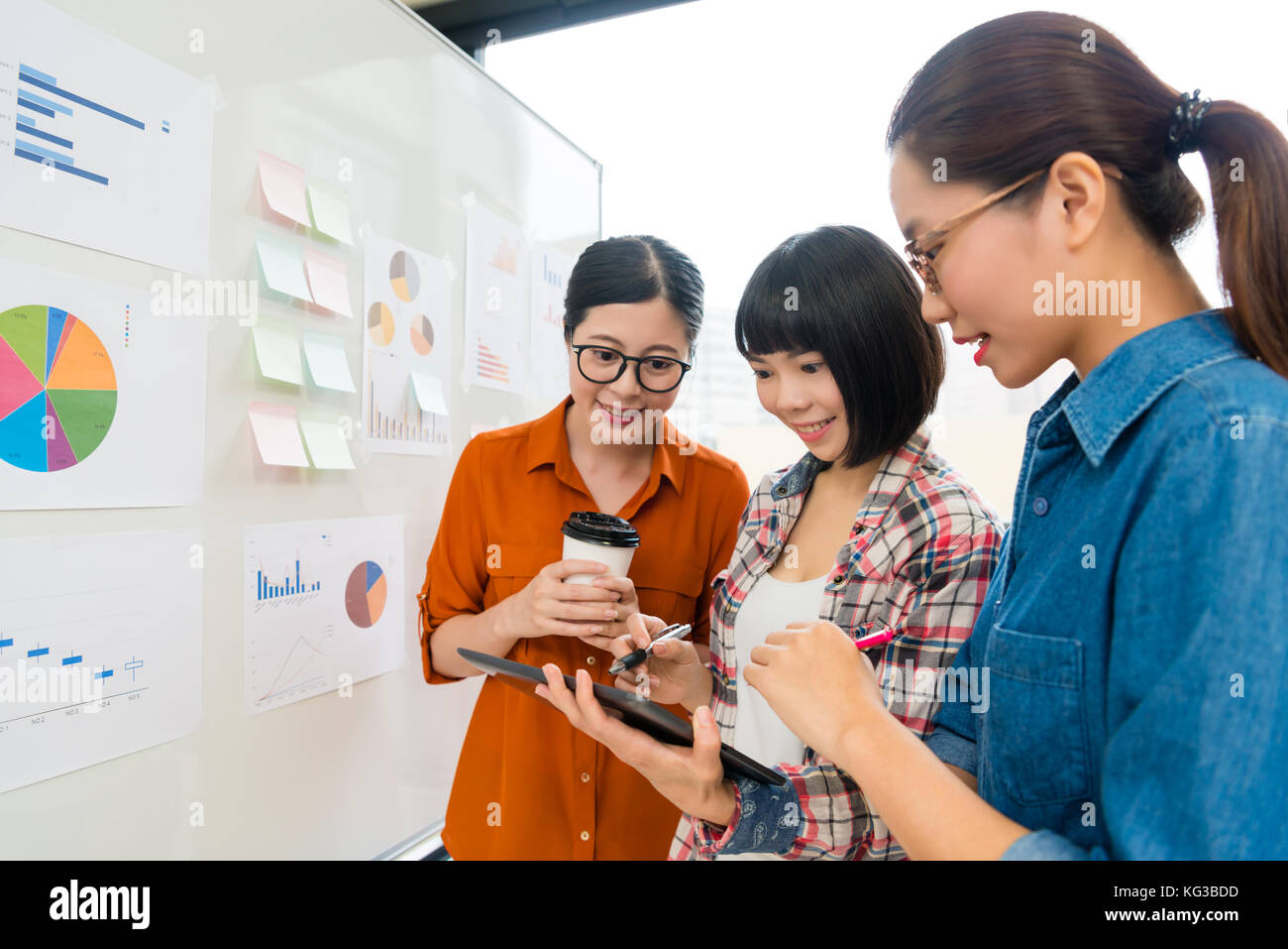cheerful pretty business women team partner standing in front of ...