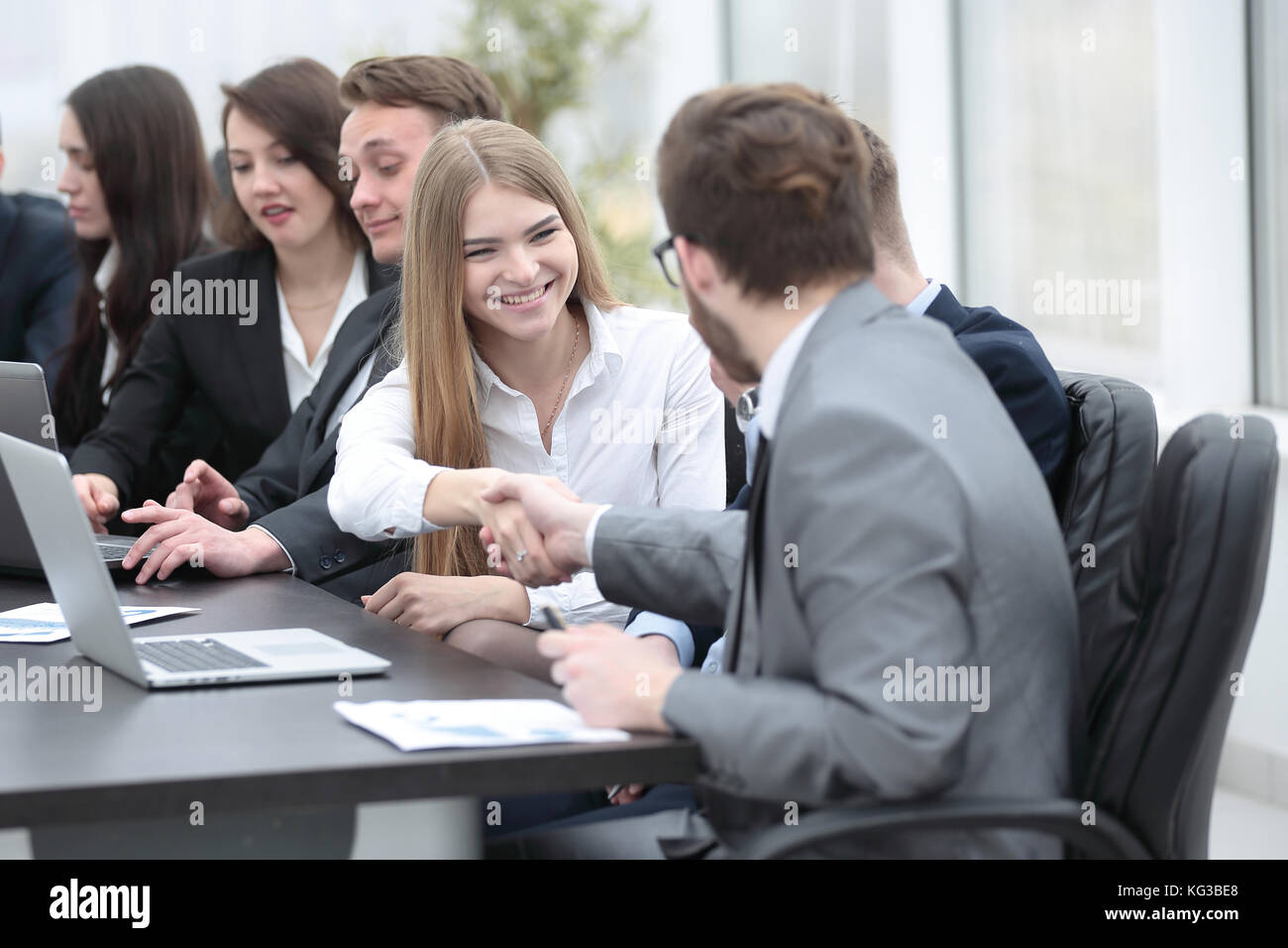 handshake Manager and the client in the office Stock Photo - Alamy