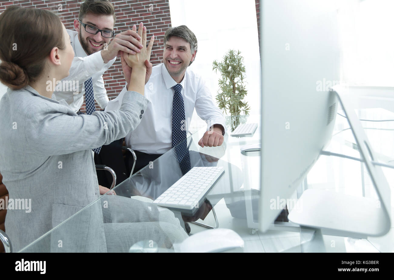 business team "makes five" as a sign of success in the workplace Stock ...