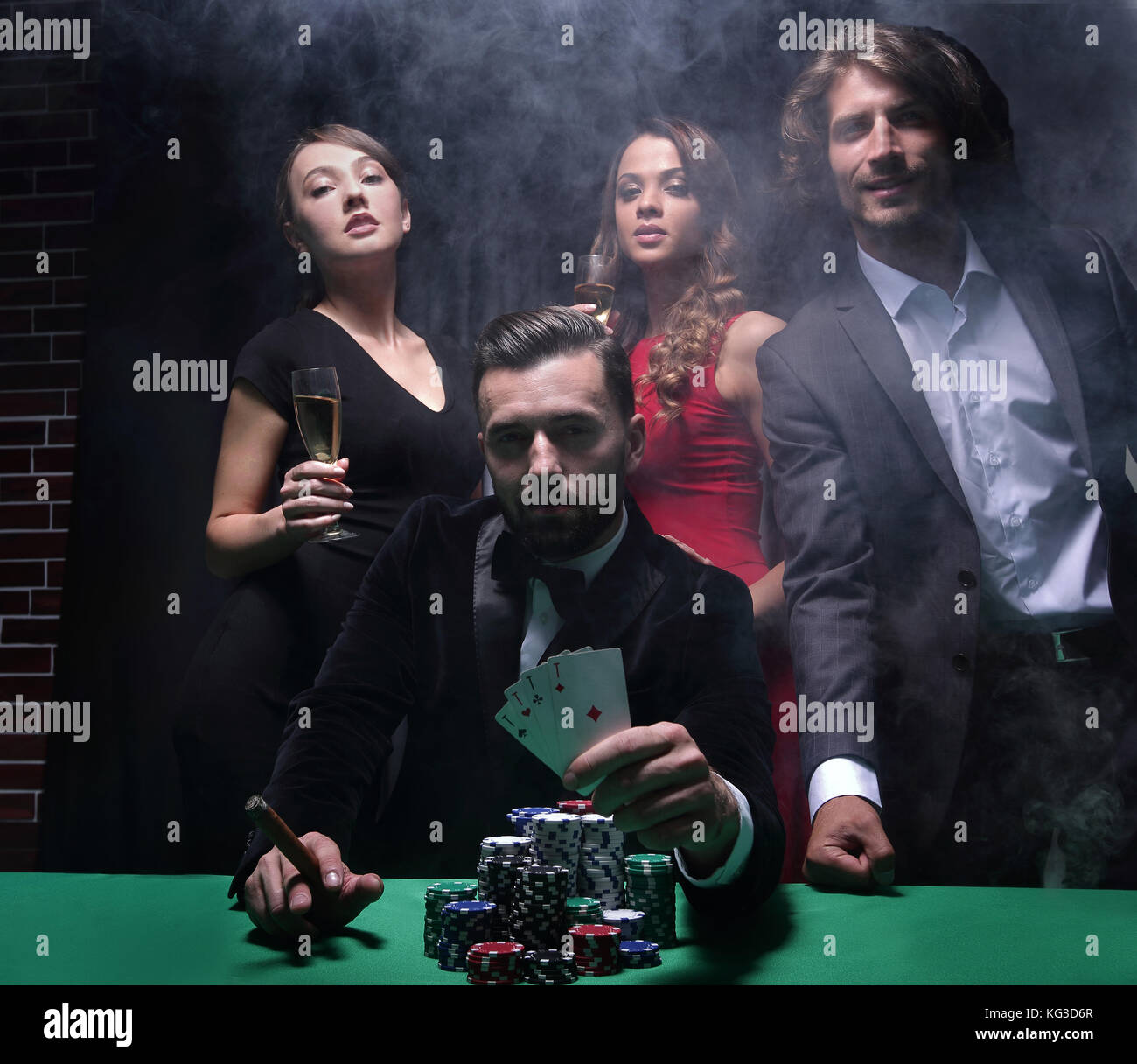 Rich handsome man smoking cigar and playing in the casino Stock Photo ...