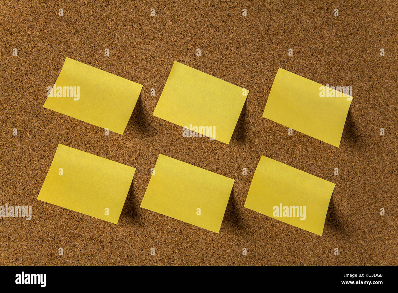 Yellow sticky notes on the cork board Stock Photo - Alamy
