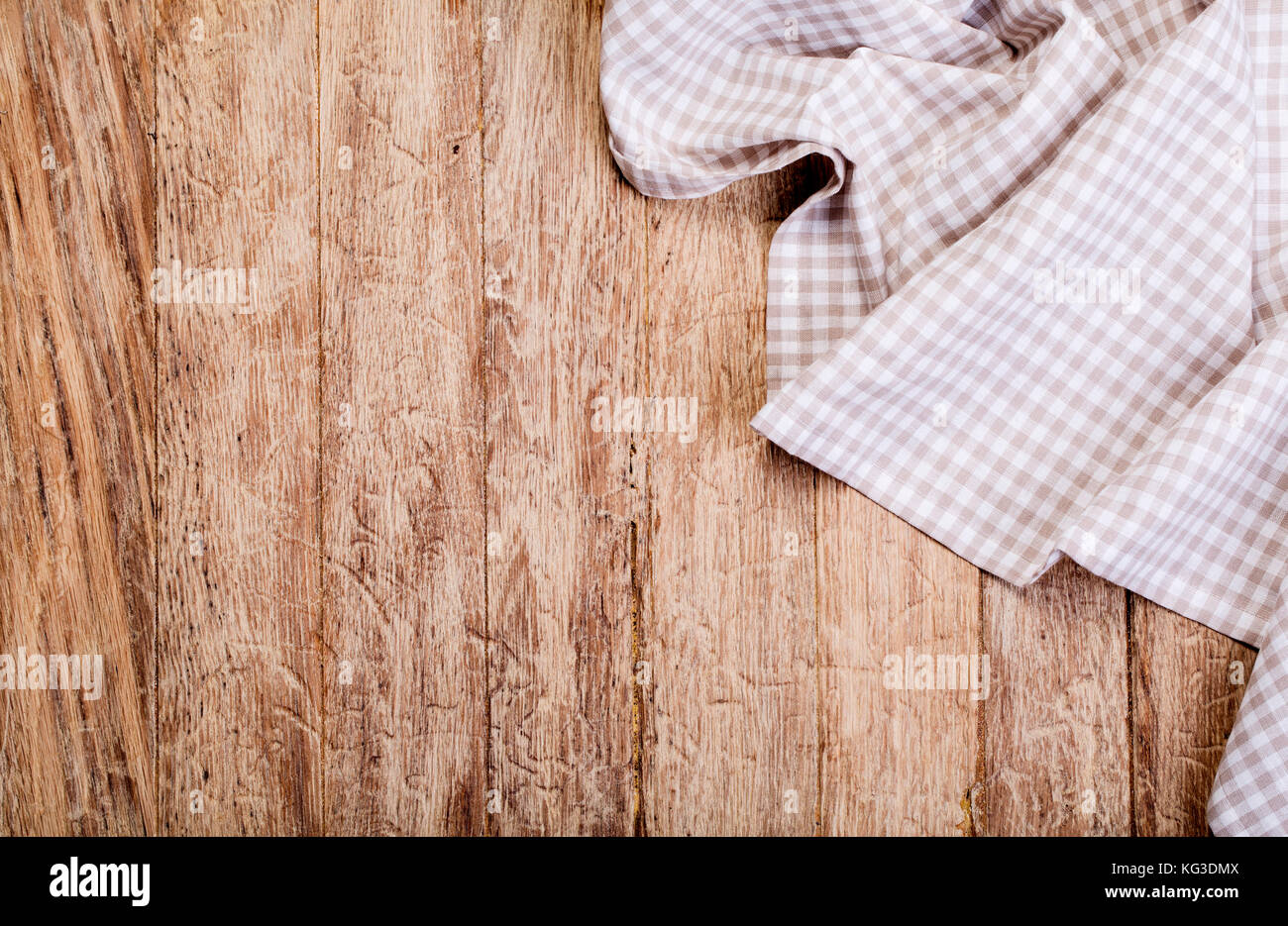 checkered tablecloth on wooden table background Stock Photo - Alamy
