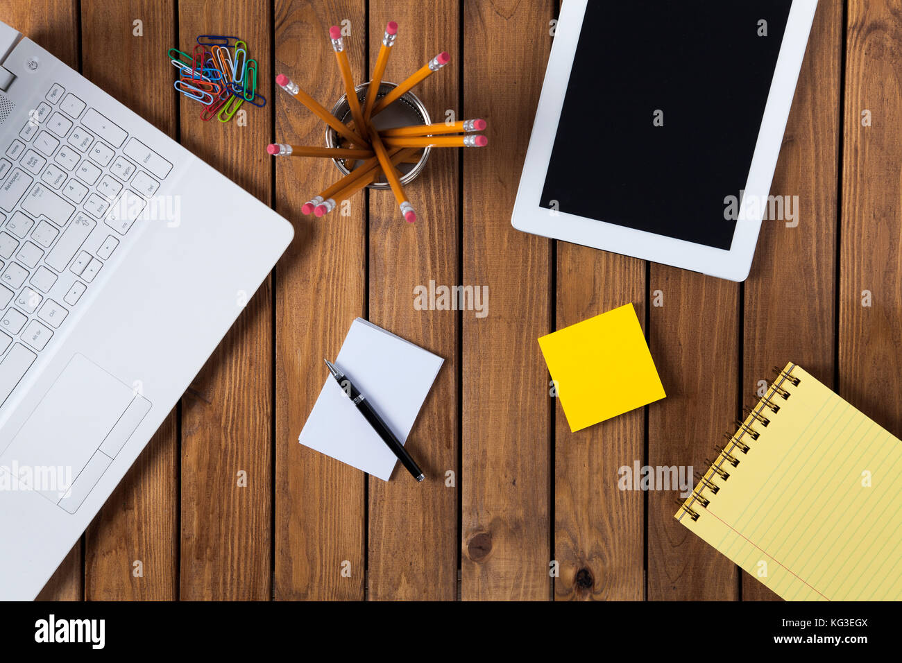 Directly above view of a old wooden table, various objects on it Stock ...