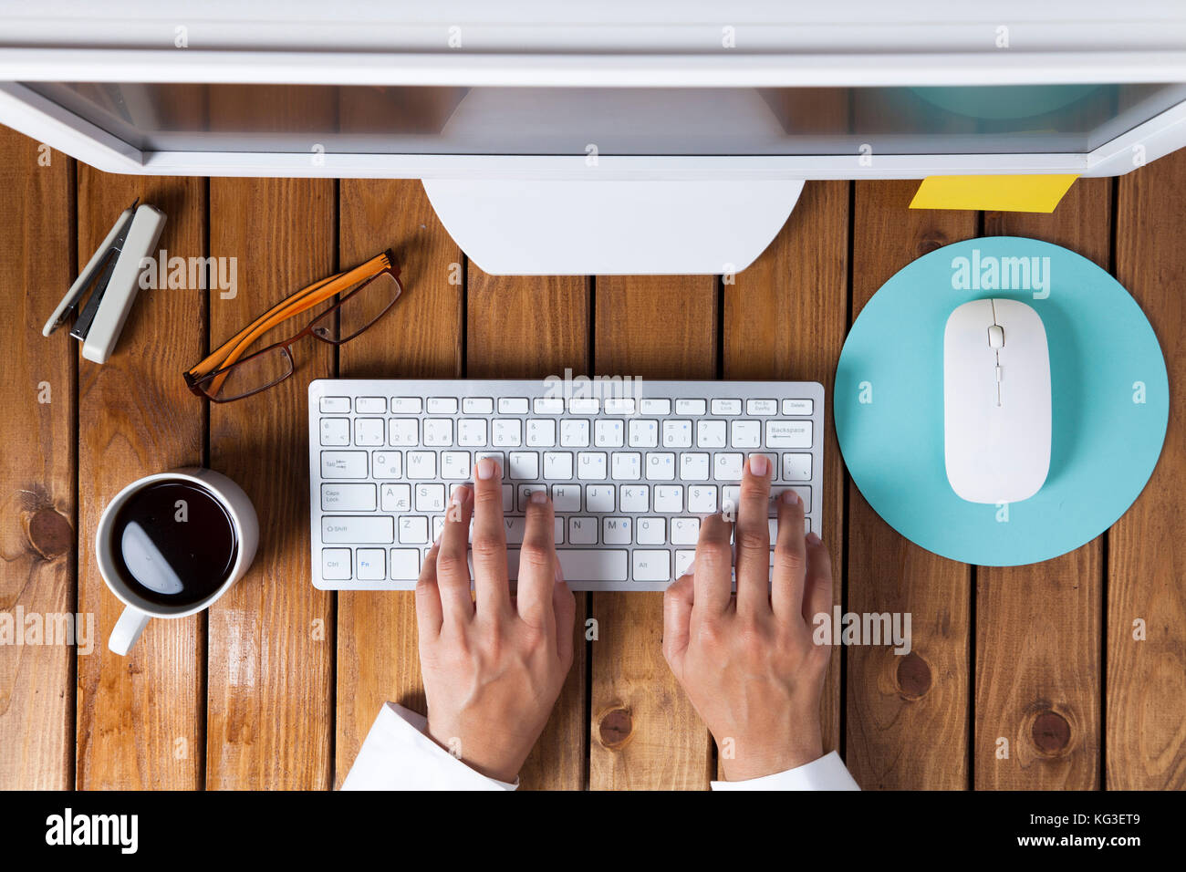 Businesswoman using pc computer on her office table Stock Photo - Alamy