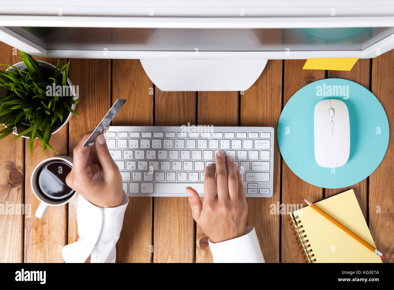 Businesswoman using pc computer on her office table Stock Photo - Alamy