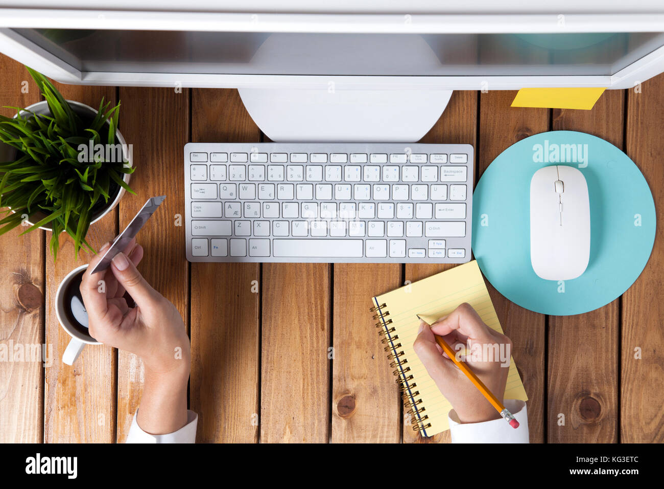 Businesswoman using pc computer on her office table Stock Photo - Alamy