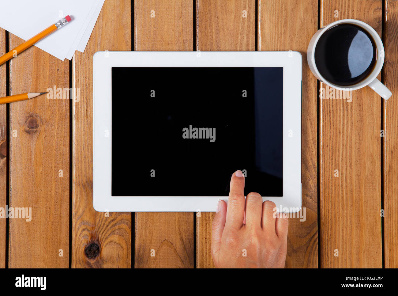 Businesswoman touching tablet pc Stock Photo - Alamy