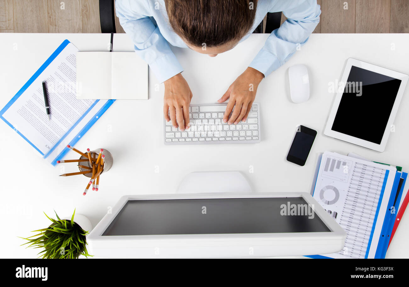 Overhead View Of Businesswoman Working At Computer In Office Stock ...