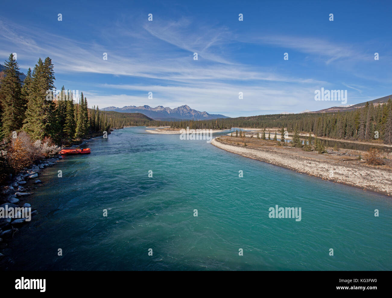 a beautiful green river with a white water raft ready for adventure ...