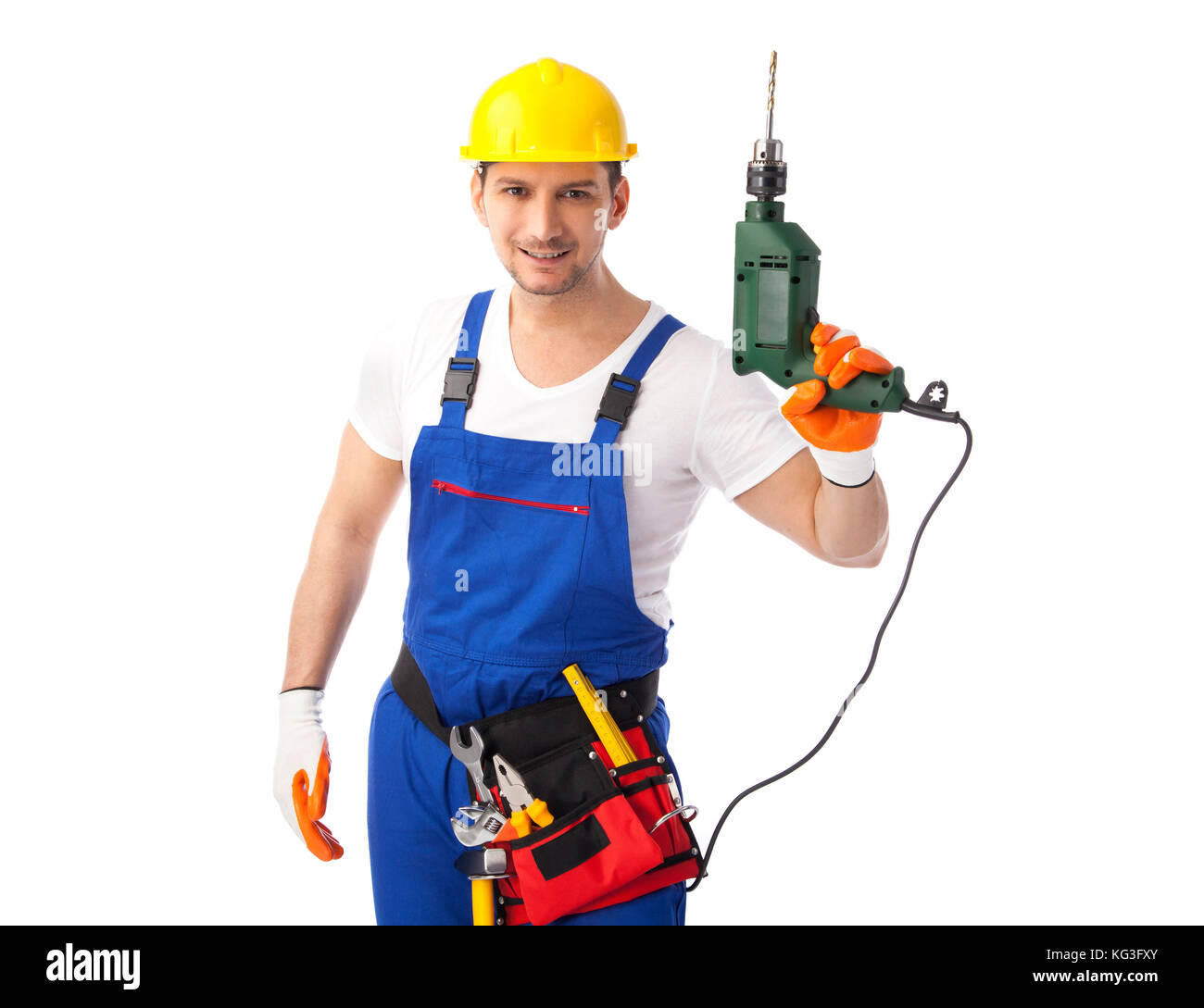 Smiling handyman wearing a hardhat and tool belt holding up his drill ...