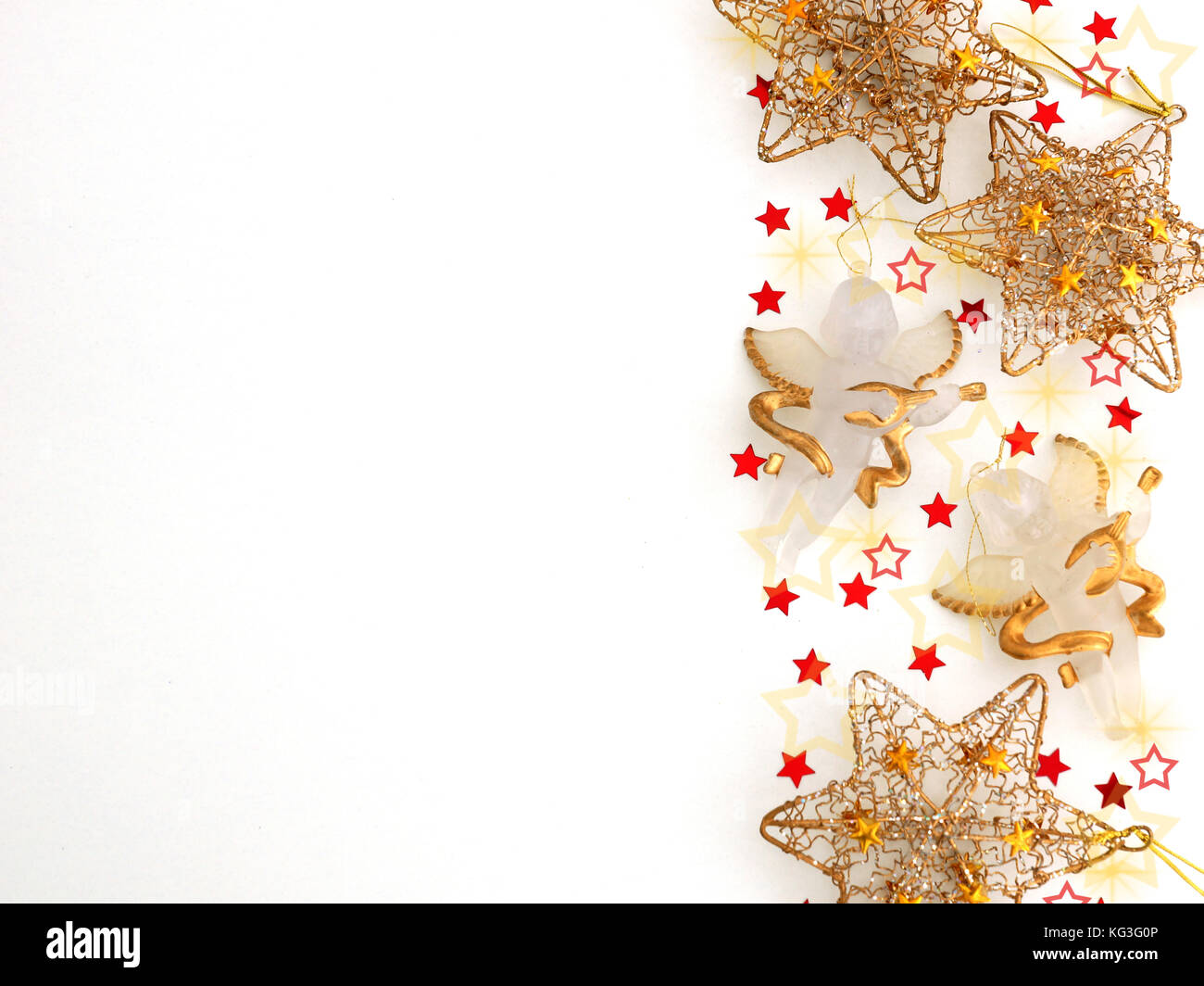 Festive decoration of golden stars and angels on a white background ...