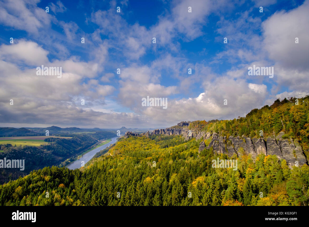 Landscape with the river Elbe valley, colorful trees and the mountain ...
