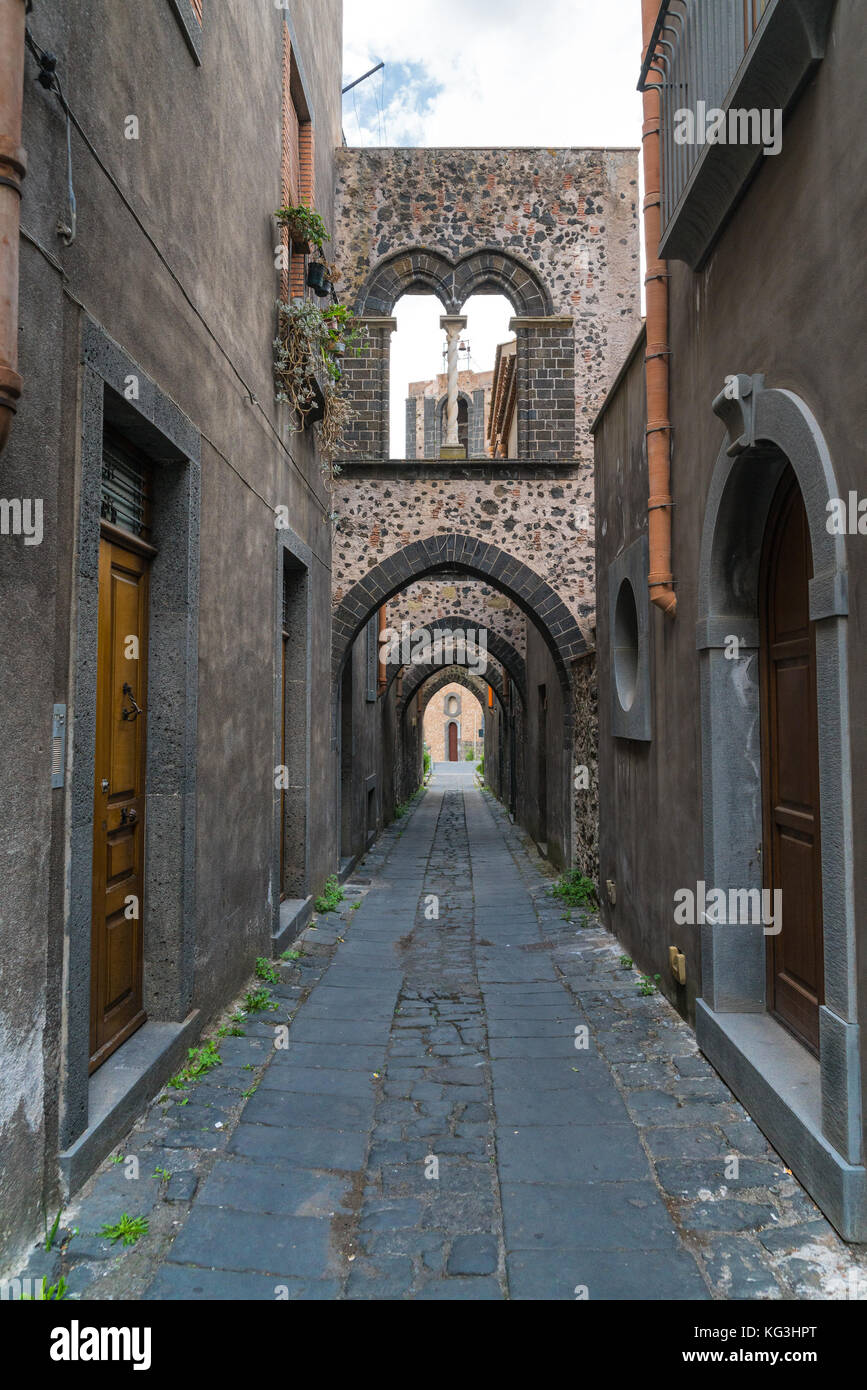 Medieval Street with four rounded arches,basalt cobbles and double ...